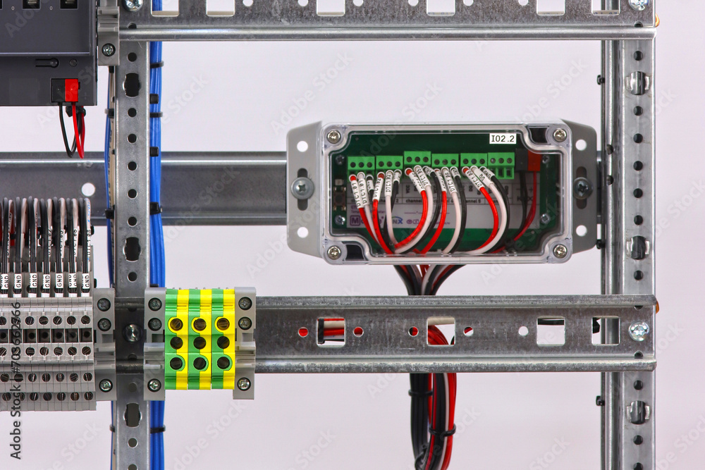 Electronic control modules for apartment automation are installed in an ...