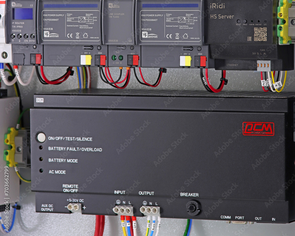 Electronic control modules for apartment automation are installed in an ...