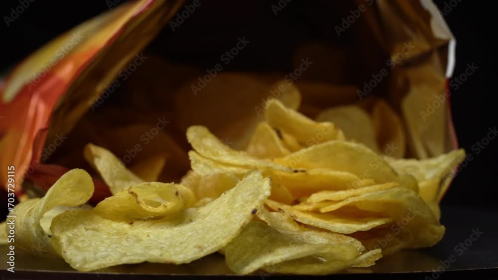 Vidéo Stock Crispy potato chips in a pack swirl close-up. Potato snack ...