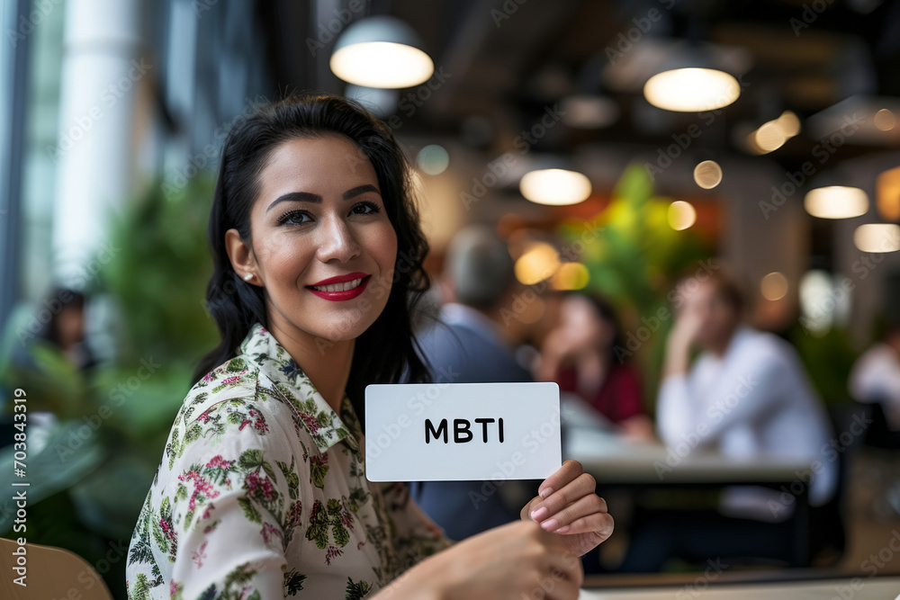MBTI concept image with business woman holding a sign with written ...