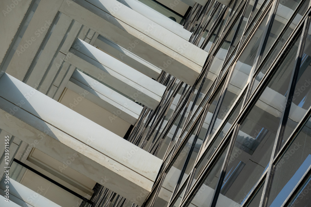 Diagonal view of a modern high-rise with intersecting lines and ...