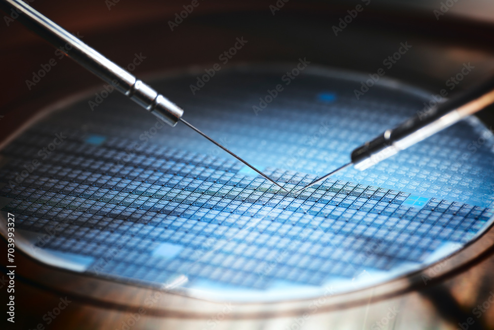 Machine checking silicon wafers in clean room laboratory, close up ...