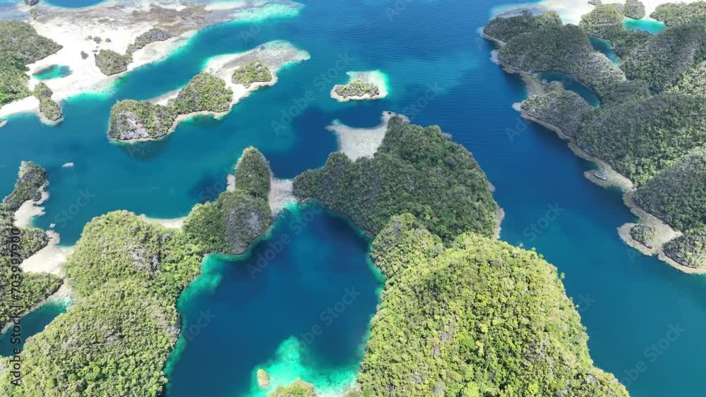 Scenic limestone islands, fringed by coral reefs, rise from the amazing ...