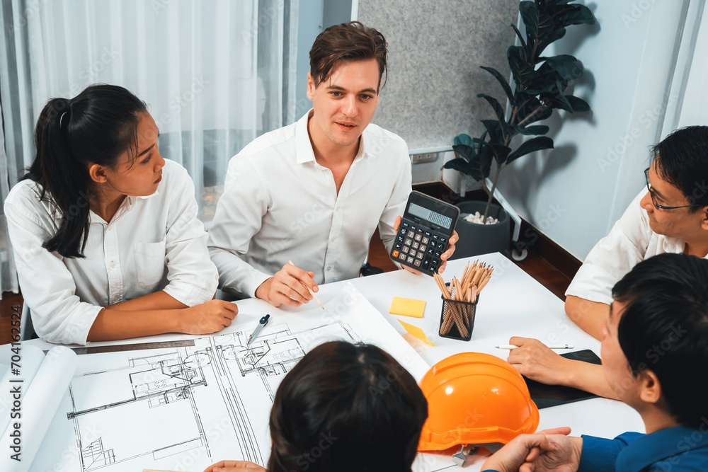 Diverse group of civil engineer and client working together on ...