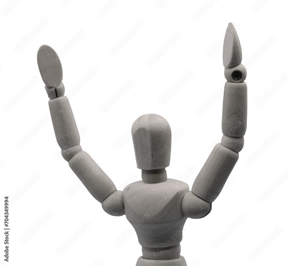 grey wooden dummy striking a dynamic pose with its arms raised ...