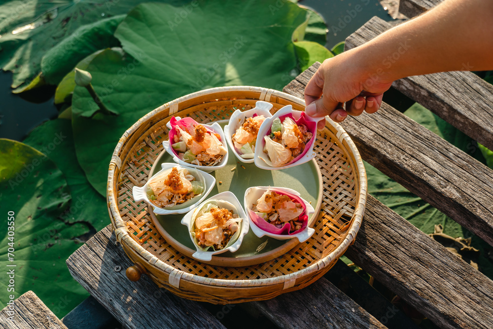 Miang Kham lotus petals-wrapped is a food that people is eaten as a ...