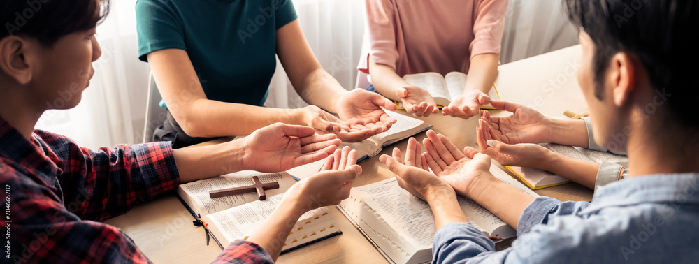 Cropped image of diversity people hand praying together at wooden ...