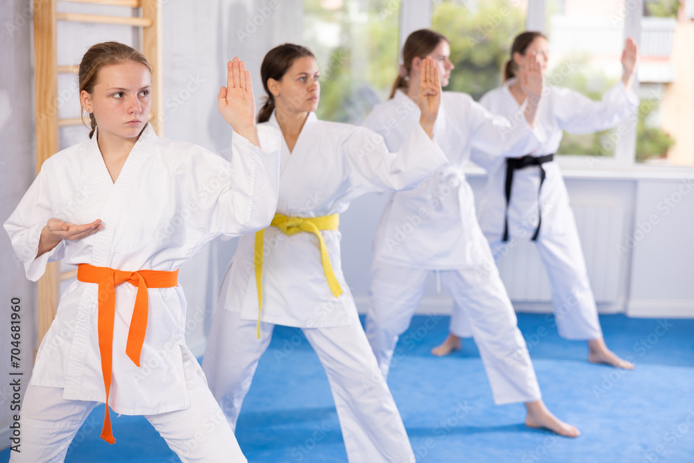 Young women athletes starting position and studying repeating sequence ...