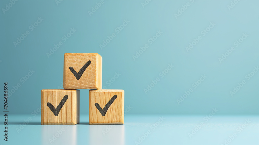 Checklist concept with copy space. Wood cubes with check marks on blue ...