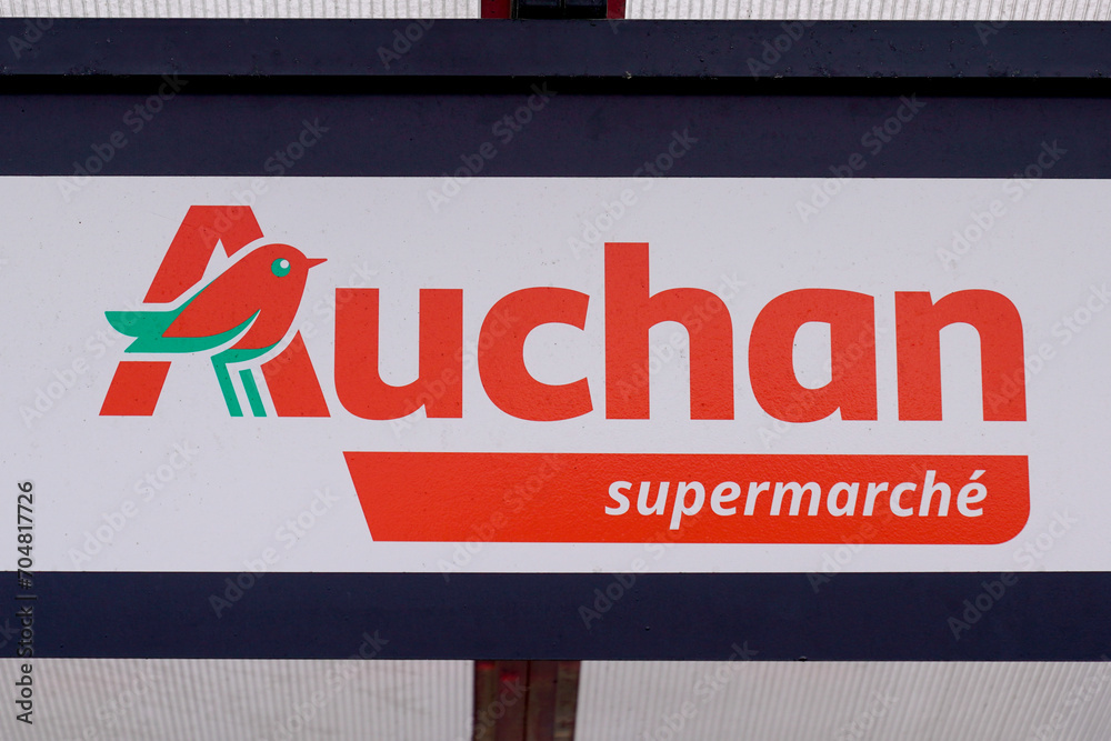 Auchan supermarche supermarket logo brand and text sign on facade wall ...