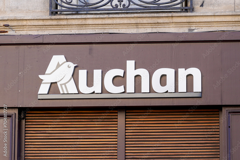 Auchan supermarche logo brand and text sign facade wall entrance brown ...