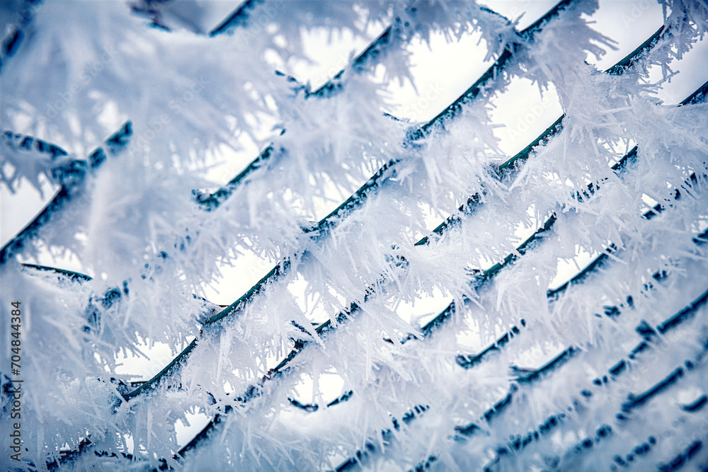 Huge hoar frost crystal accumulation on a chain link fence grid surface ...