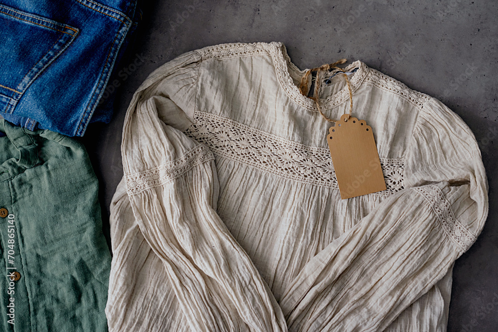 Clothes from females wardrobe on shelf of second hand store. second ...