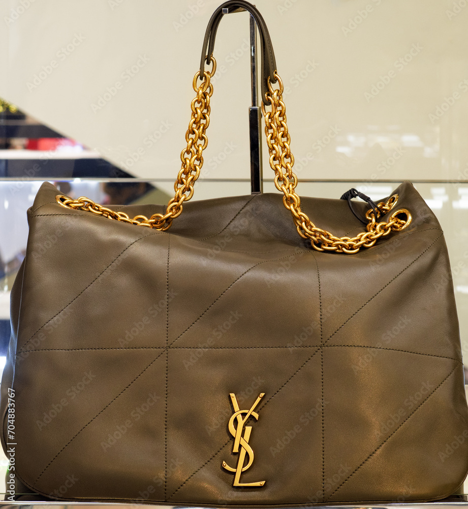 Gold chain shoulder bag in soft brown leather.YSL logo by Yves Saint ...