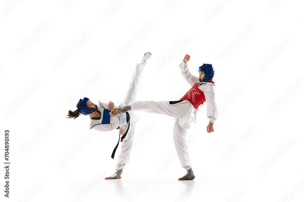 Leg kick. Young girl, competitive taekwondo athletes in dobok and ...