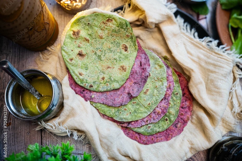 Roti top view over white background, Beetroot and Methi Leaves paratha ...
