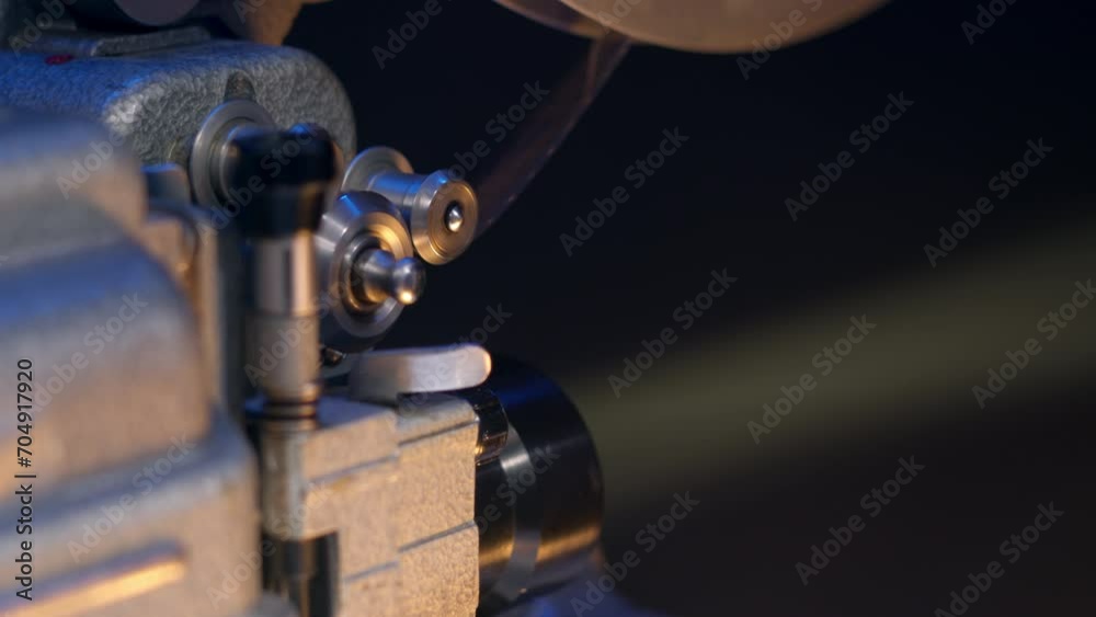 vintage 16mm film projector in cinema theater displays first films to ...