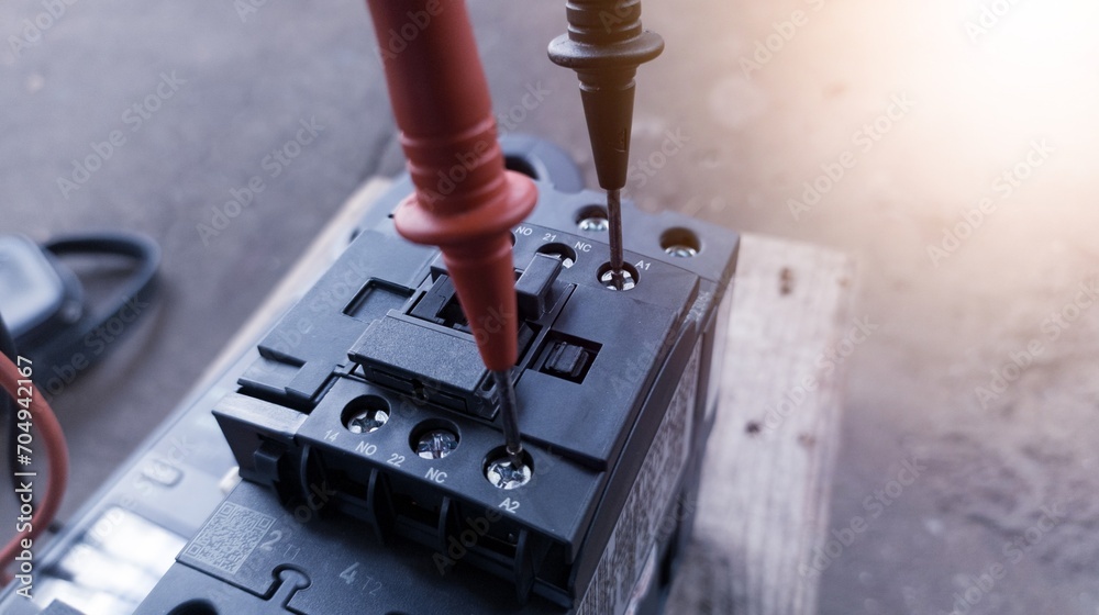 Checking magnetic contactor terminals using a multimeter, magnetic ...