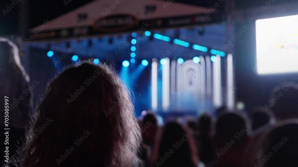 Happy people watching amazing musical concert. Bright colorful stage ...