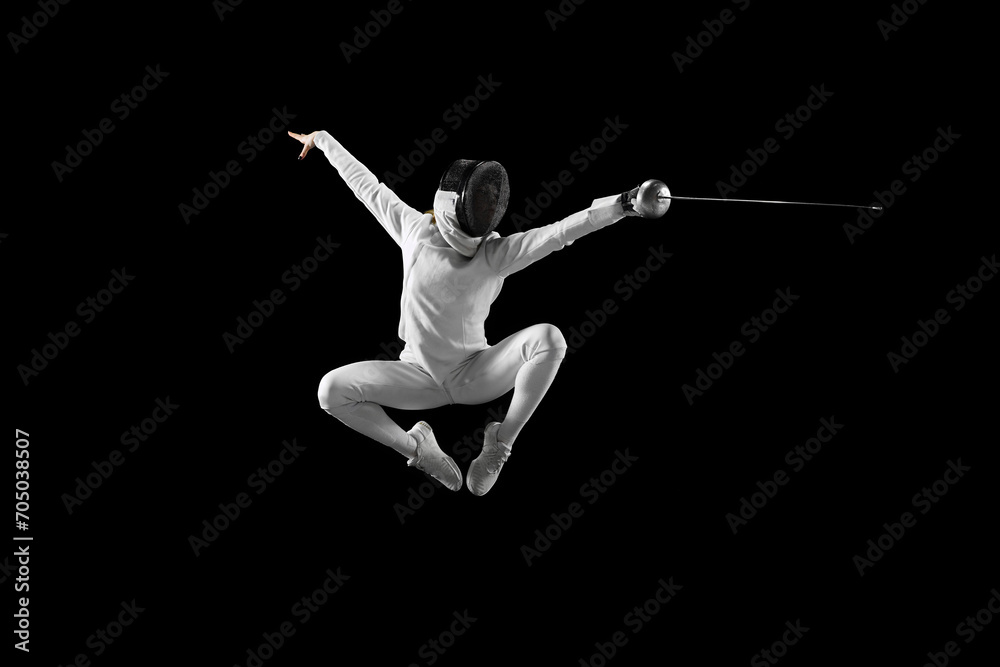 Dynamic mid-air snapshot of swift motion of female fencer's blade ...