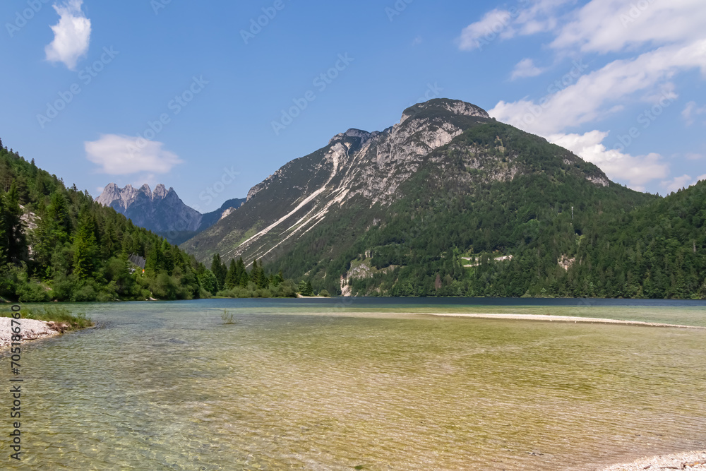 Scenery of Lake Predil with panoramic view of majestic mountain peak ...