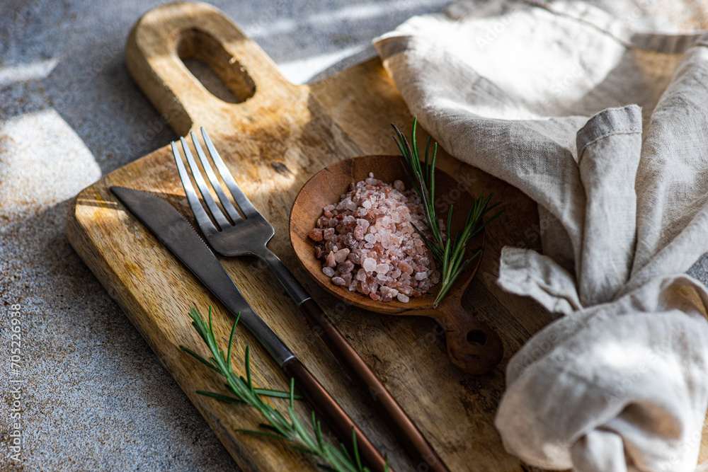 From above rustic kitchen setup on wooden cutting board with a fork ...