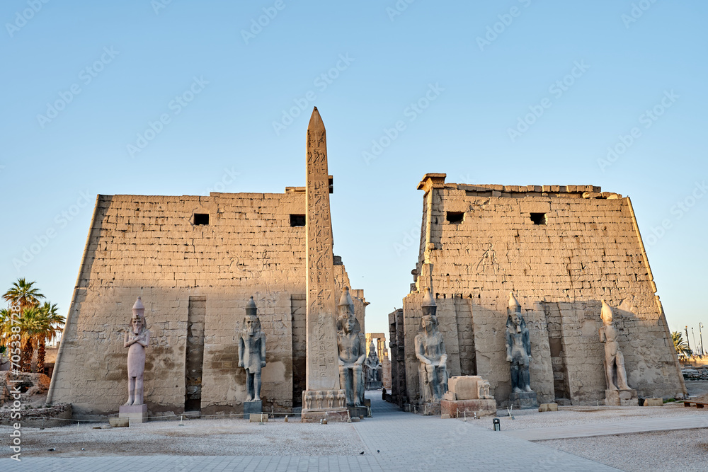Seated statue of Ramesses II by the First pylon of the Luxor Temple ...
