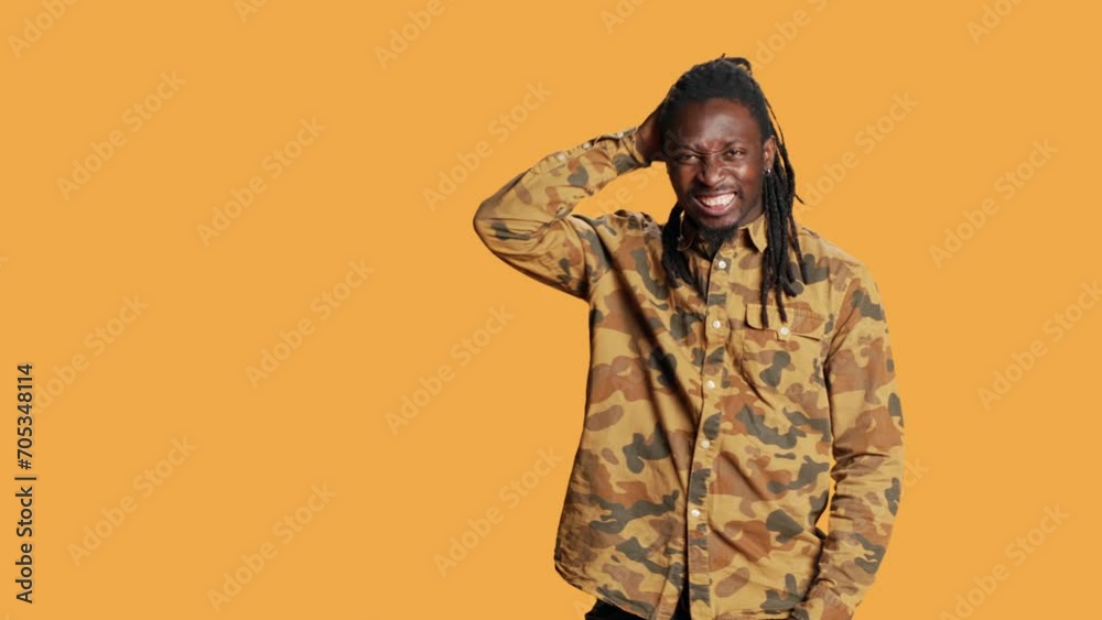 African american focused man acting confused and clueless, posing with ...