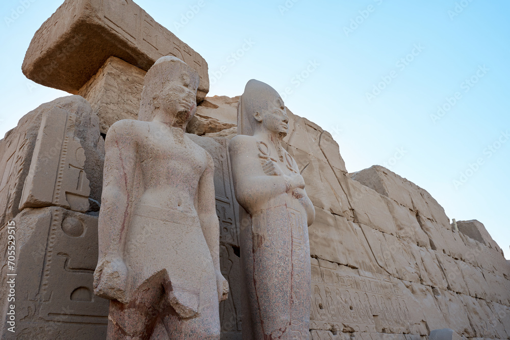 Seated statue of Ramesses II by the First pylon of the Luxor Temple ...