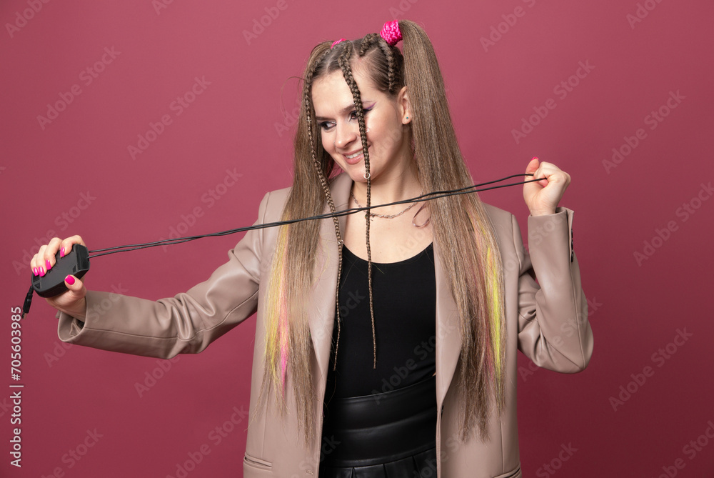 Beautiful young woman with lots of computer cables over her head ...