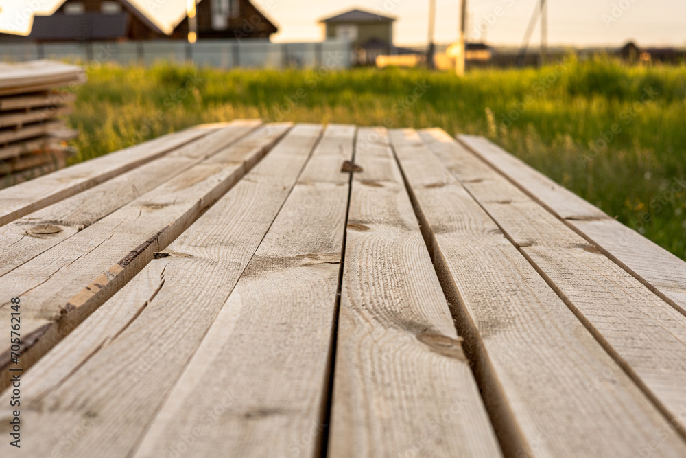 Solid-sawn lumber, sawn timber, solid wood. Wood materials on green ...