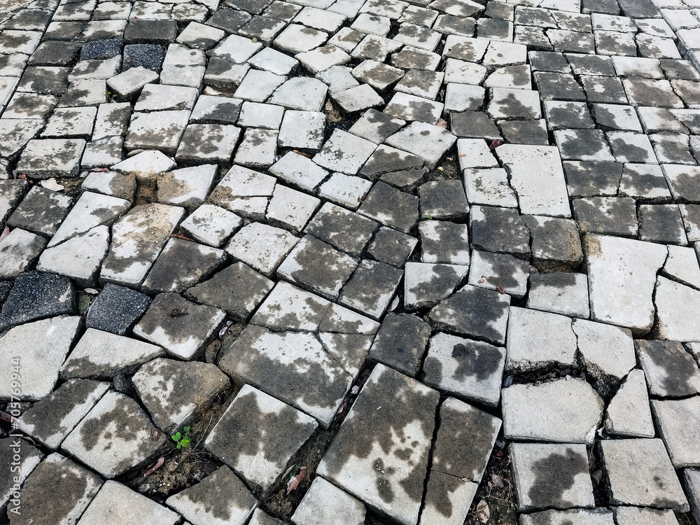 Top view texture of the brick blocks floor in the cracks. The surface ...