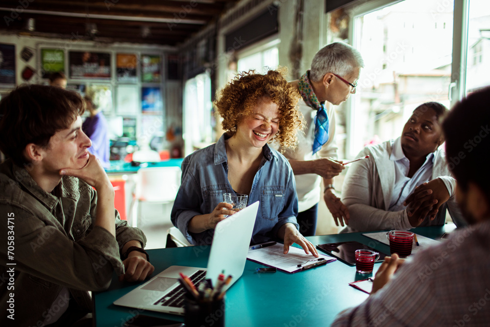 Multigenerational and diverse group of people working on a project ...