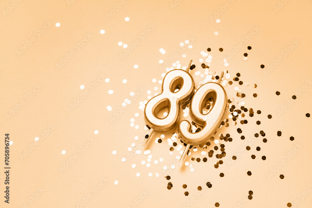 89 years celebration festive background made with golden candles in the ...