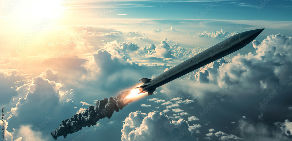Hypersonic missile. A combat rocket is flying above the clouds. Missile ...