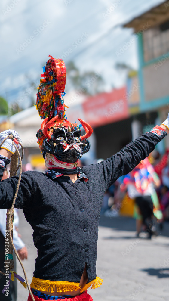 People with devil masks dancing at the Diablada Pillarena, a ...