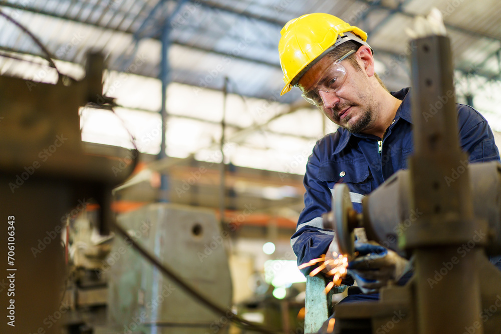 Professional metal work worker sharpening and grinding metal pipe. Man ...