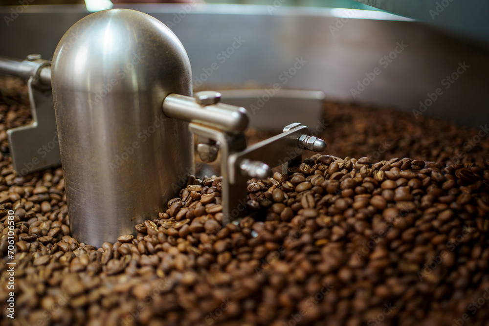 Professional coffee roaster working with modern automated roasting ...