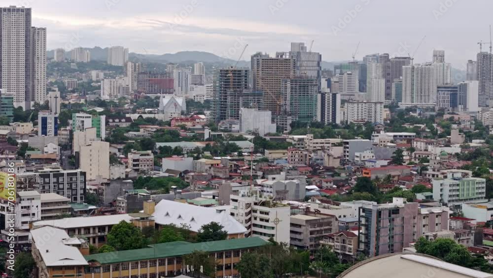 Cityscape of Cebu City on a grey day showing dense high rise buildings ...