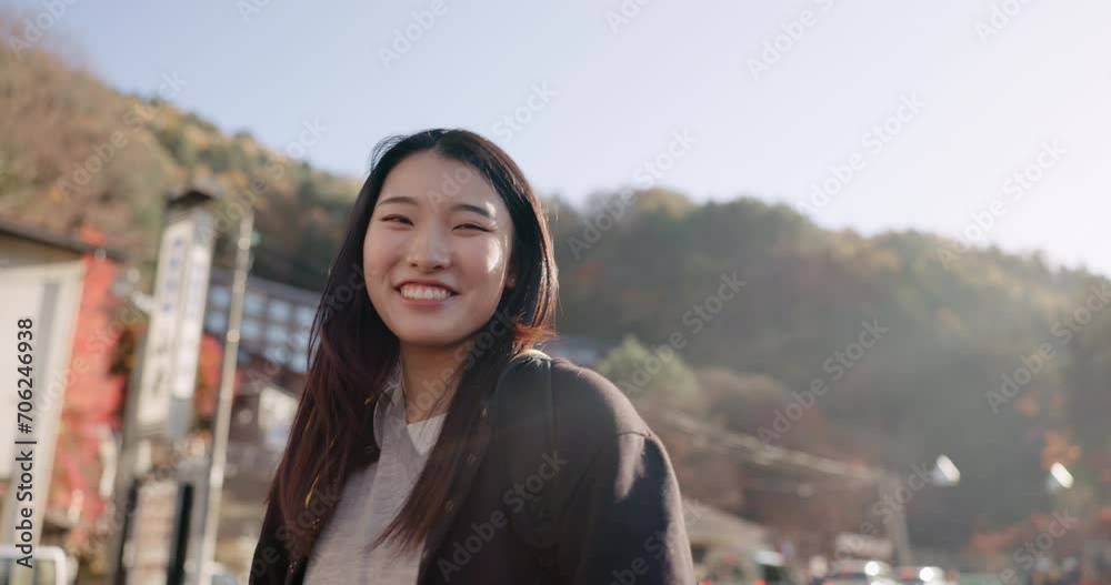 Japanese woman, walking and face in city, street and sunshine with ...