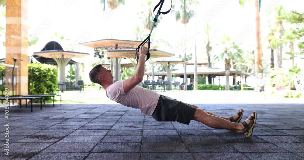 Muscular athletic powerful bodybuilder, athlete using sports equipment ...