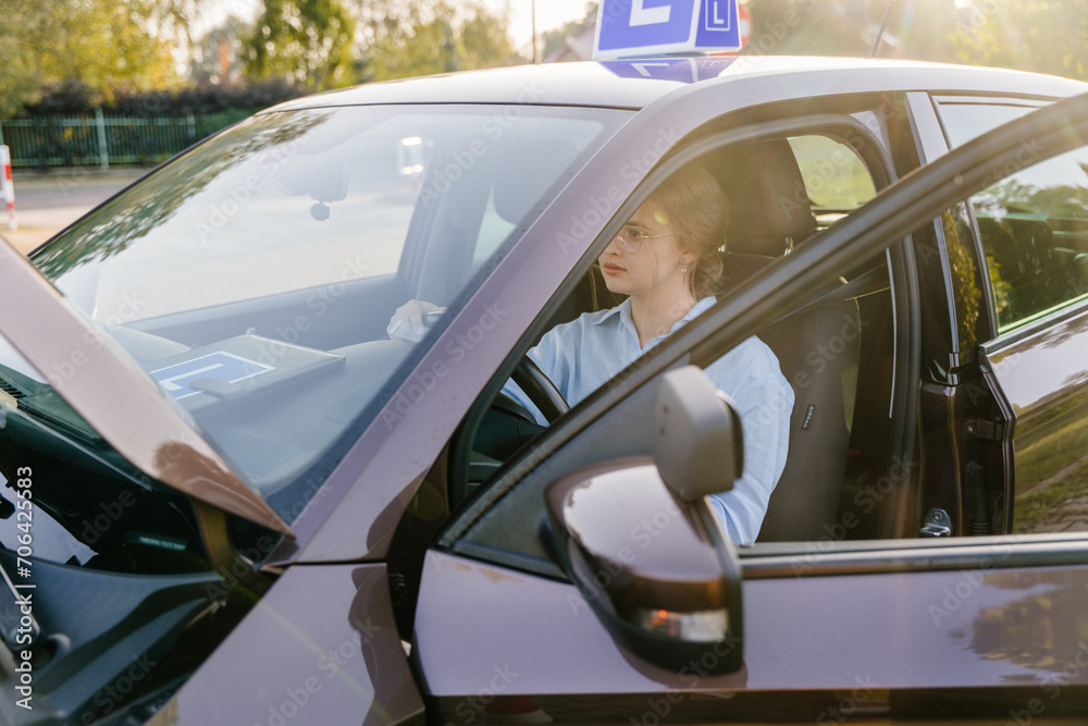 Test drive, transportation, safety, education concept. Female student ...