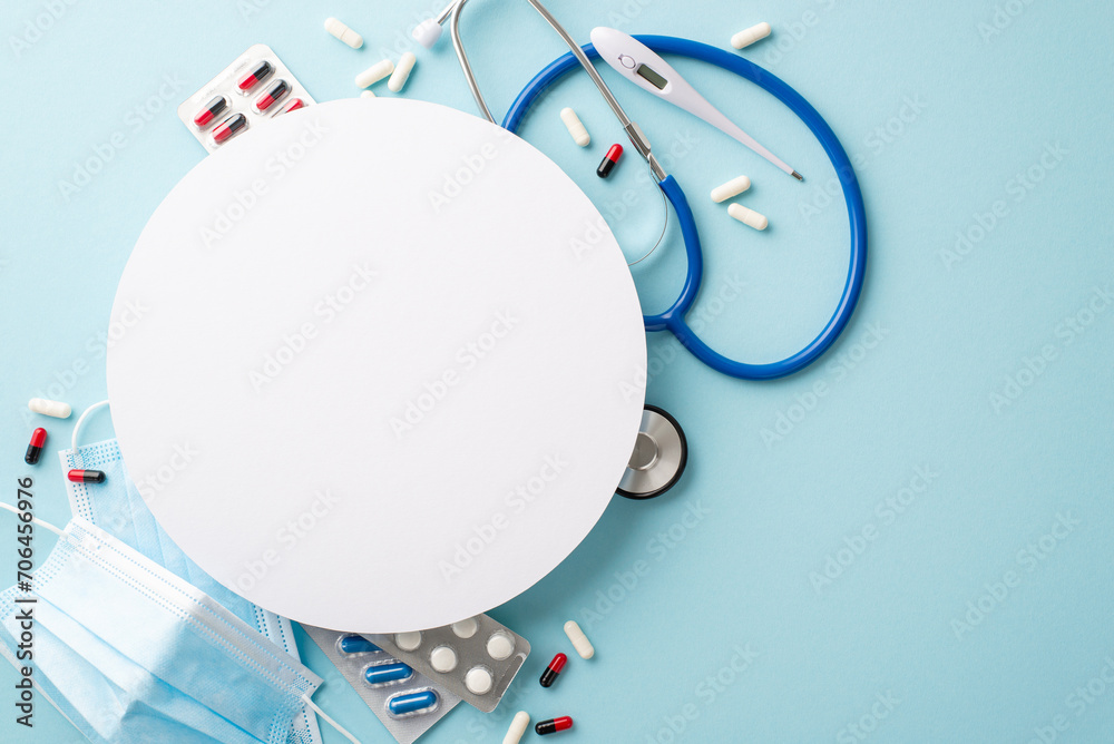 Doctor's office essentials. Top view stethoscope, face masks, pill ...