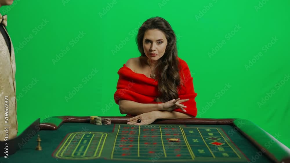 Portrait of attractive female on chroma key green screen. Woman in red ...