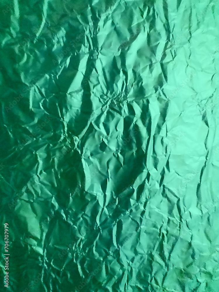 Texture of crumpled green foil. Background for design, print and ...