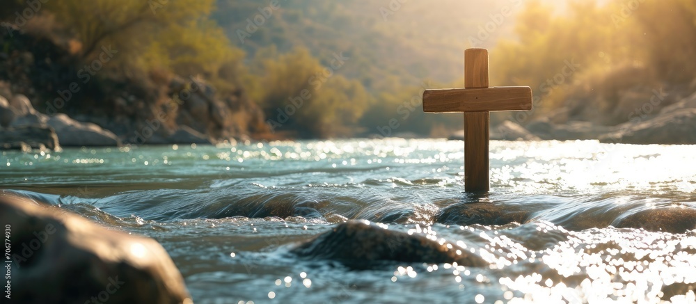 Foto de symbol of Baptism a wooden cross in the Jordan River. with copy ...