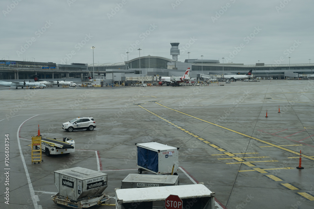 Airport dispatch tower, airplanes and airport equipment at Toronto ...