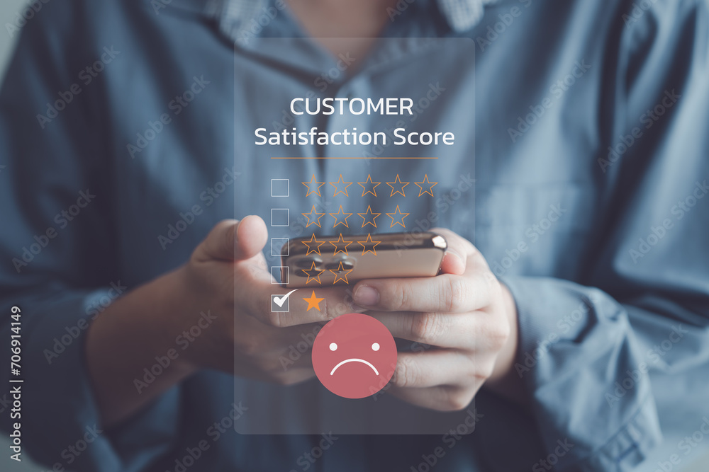 Customer using mobile smartphone for giving review the service score ...