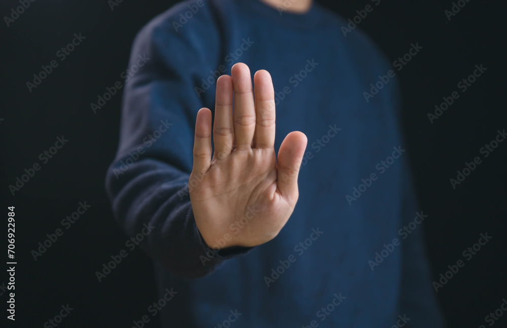 Foto de person's hand showing palm gestures stop, concept violence ...
