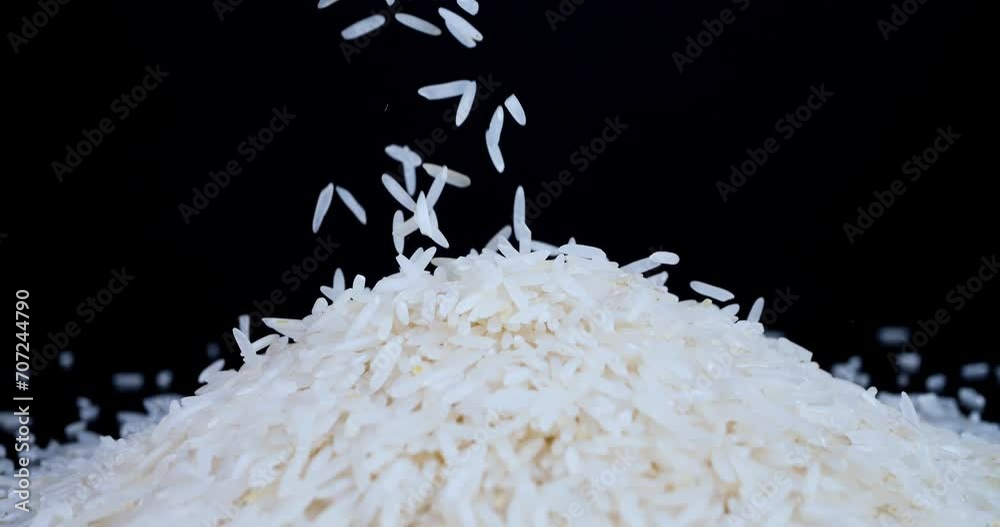 Basmati white rice falling on a black spinning background. Basmati rice ...